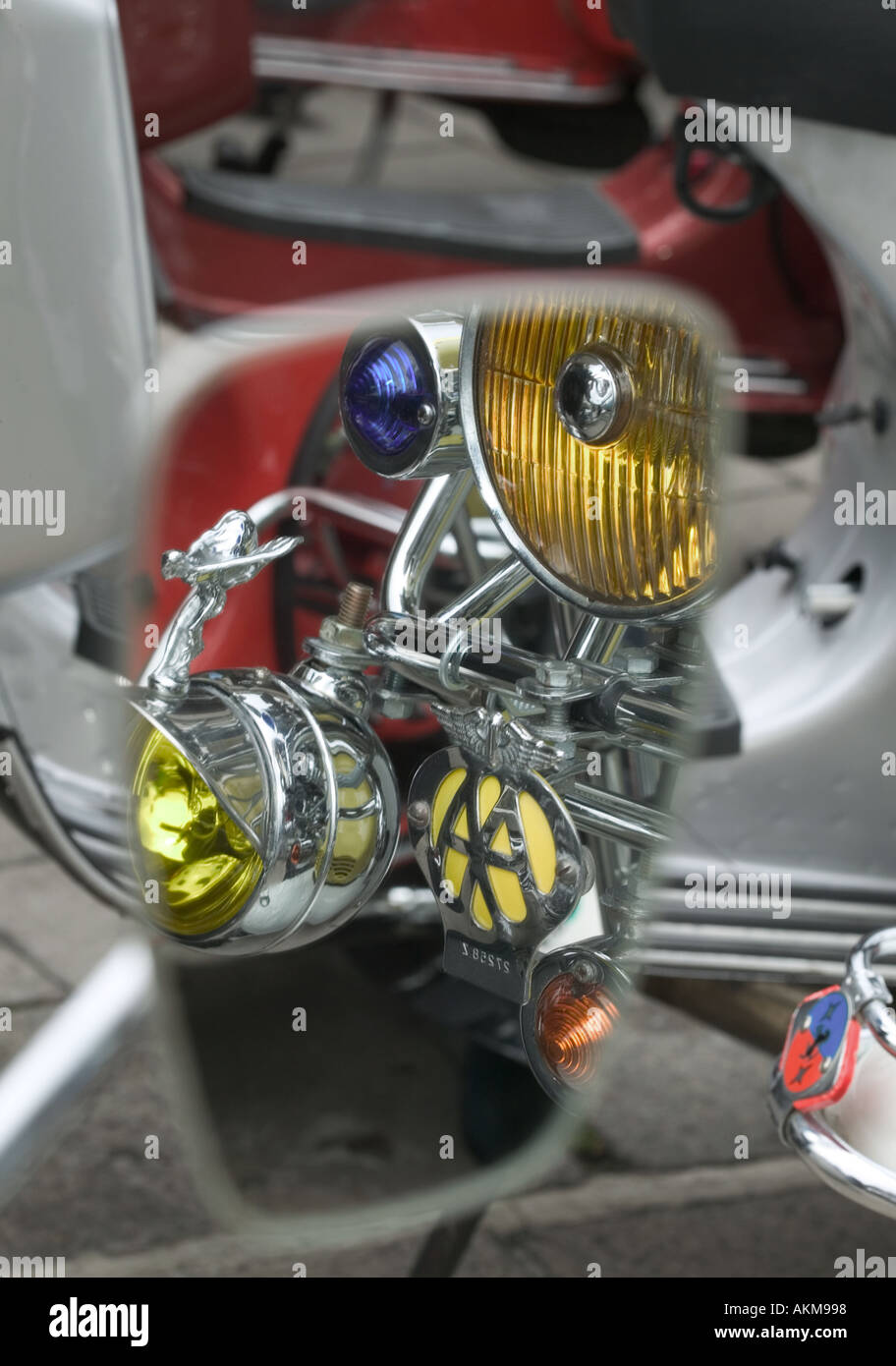 Mod's scooter and AA badge reflected in the chrome wing mirror of ...