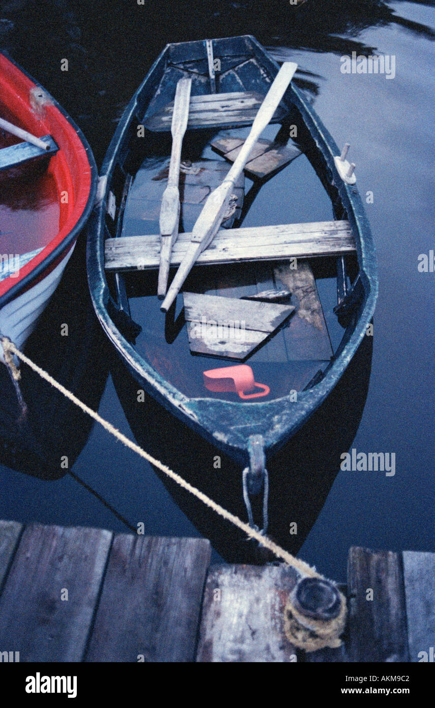a leaky rowing boat Stock Photo - Alamy