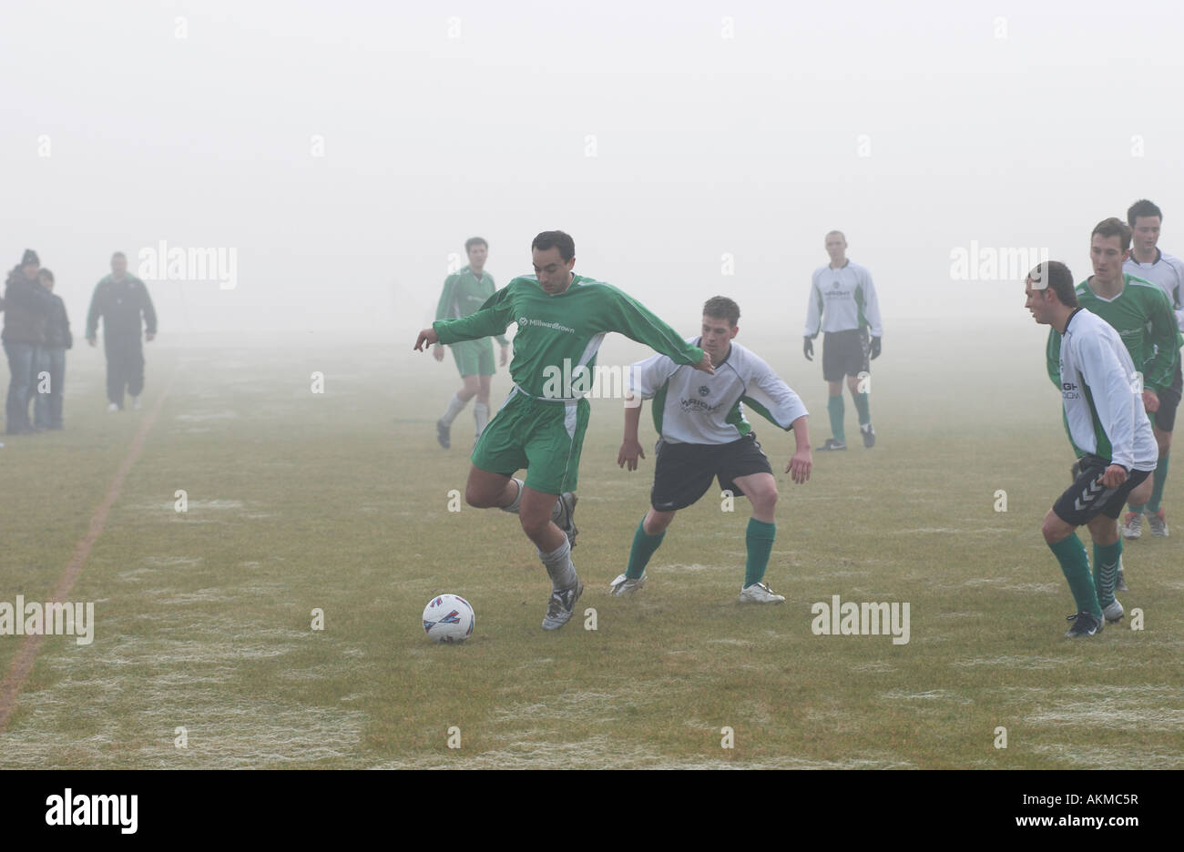 Sunday League football in fog at Harbury Lane, Leamington Spa, England ...