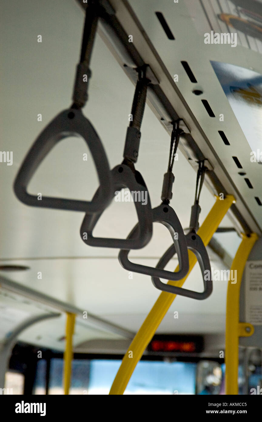 View of series of handles in an empty London bus Stock Photo - Alamy