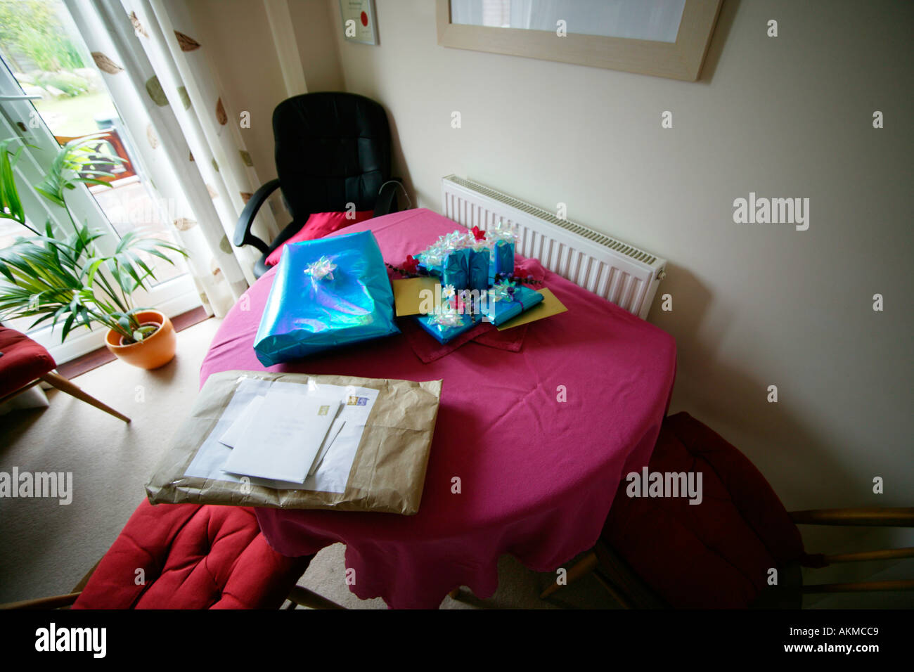 Birthday Morning Presents Laid Out On Table Awaiting Opening Stock ...