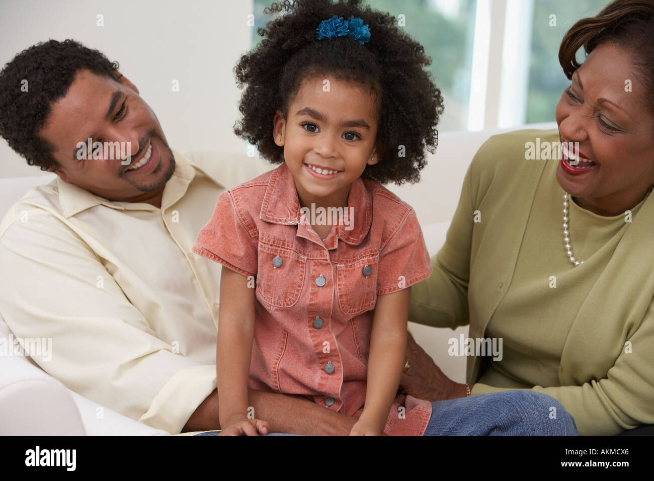 Family smiling for the camera Stock Photo - Alamy