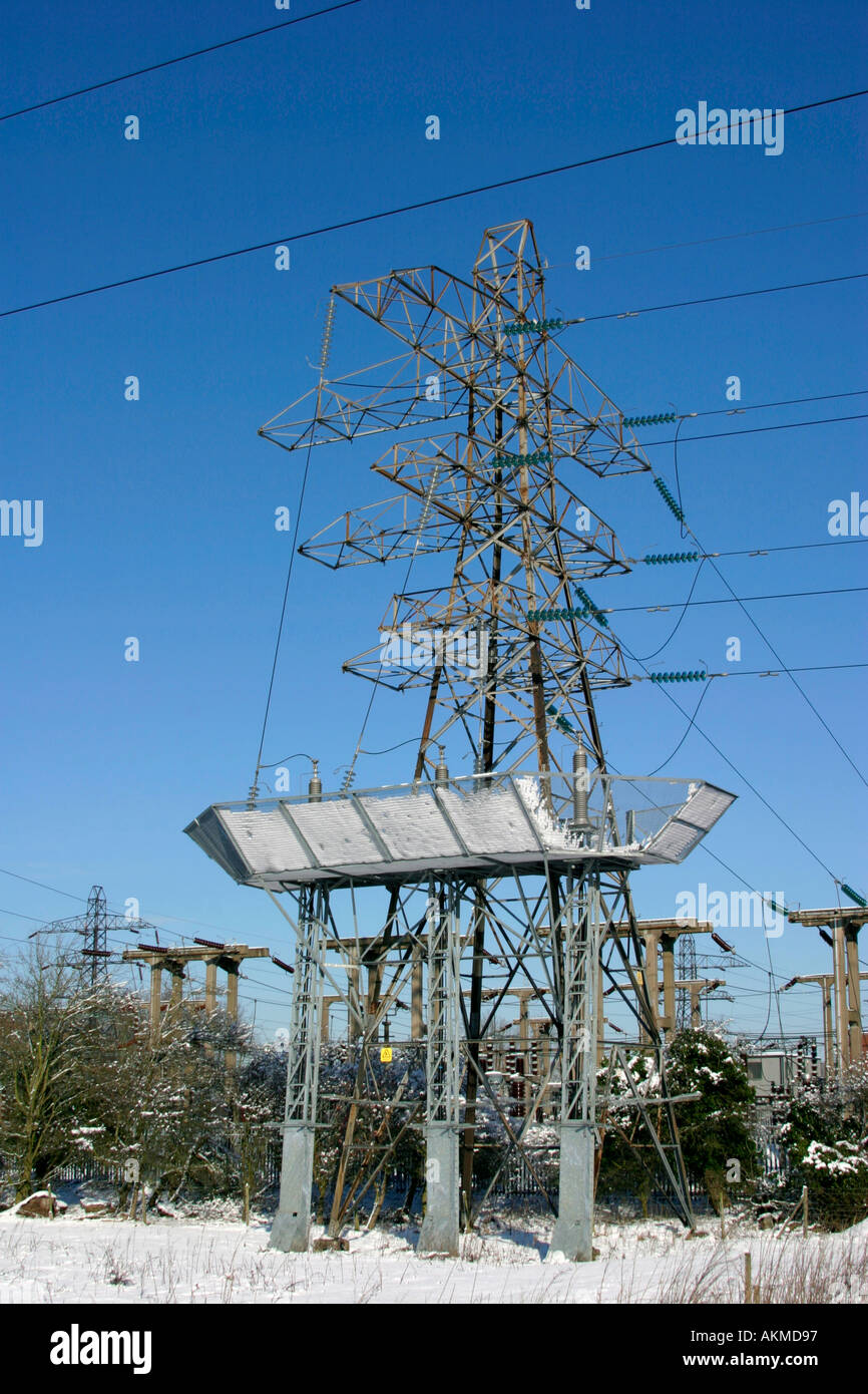 Pylon and Substation in Snowy Field Stock Photo - Alamy