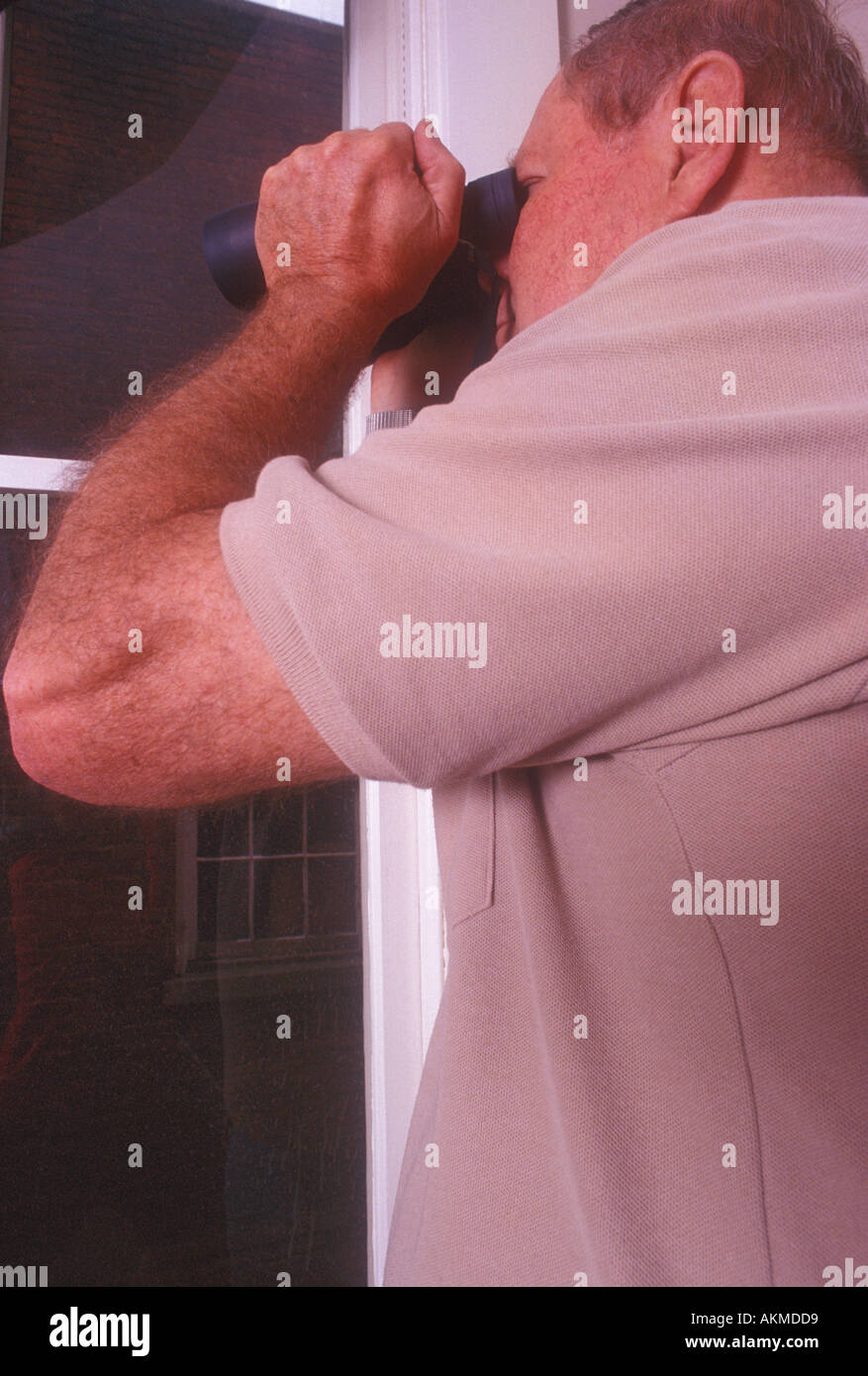 Man spying on his neighbor hi-res stock photography and images - Alamy