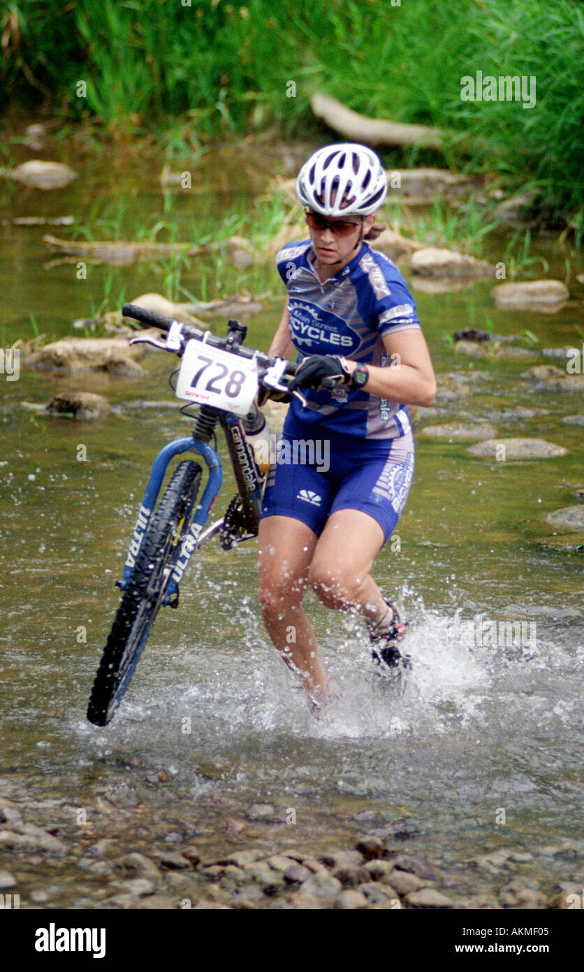 Female fords a stream Mountain bike race competition test abilities of ...