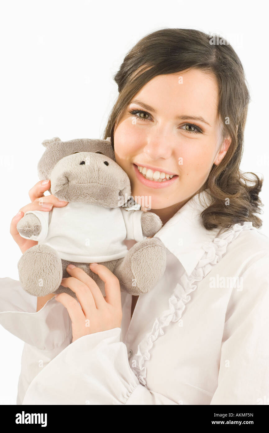 Young smiling woman with stuffed animal Stock Photo - Alamy