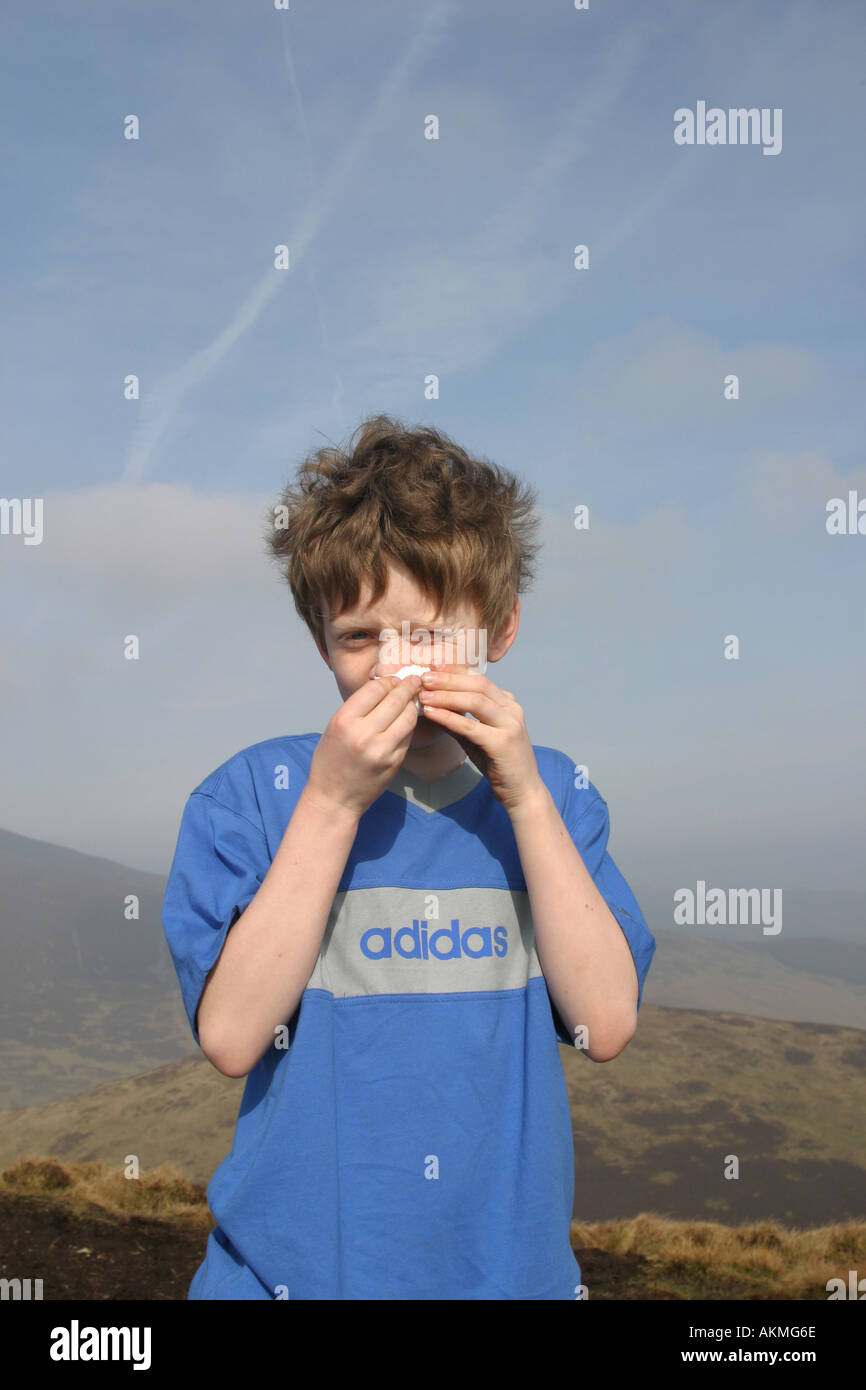 boy blowing his nose Stock Photo - Alamy