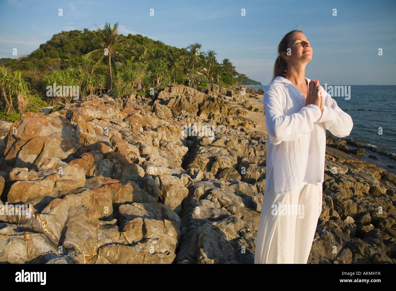 A woman meditating Stock Photo - Alamy