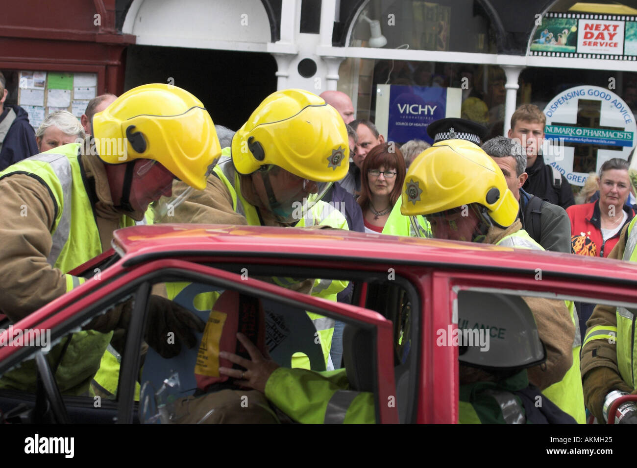 emergency services treat an injured driver in a car crash scenario ...