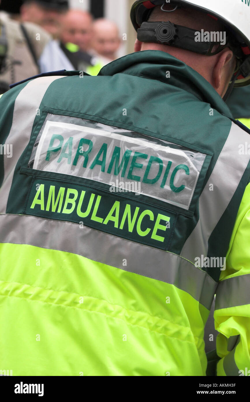 paramedic helping a car crash victim in a practice scenario showing ...