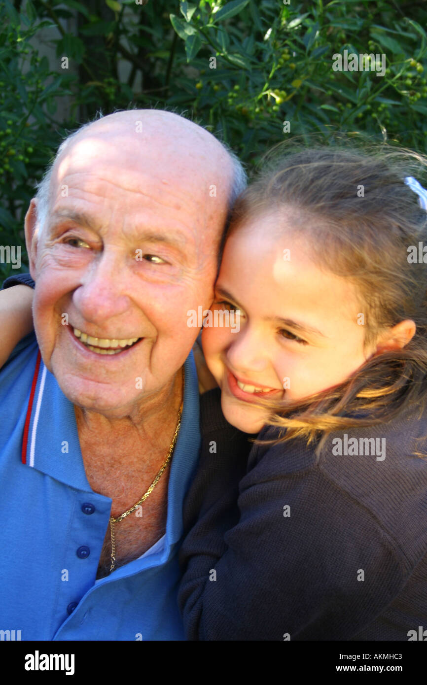 Grandad and grandchild hugging Stock Photo - Alamy