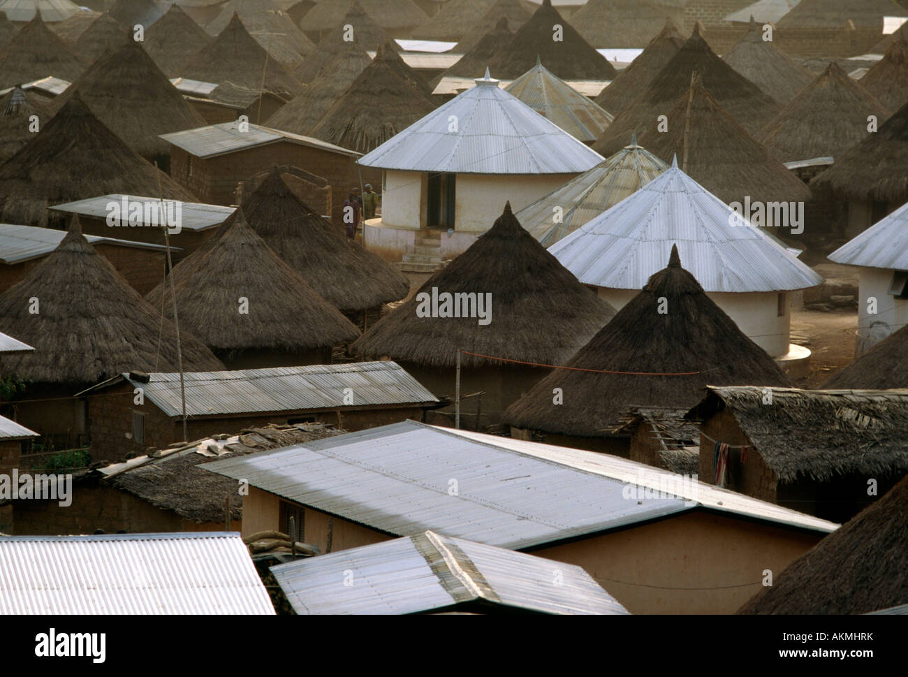 Overview of traditional round houses some with a tin roof in a village ...