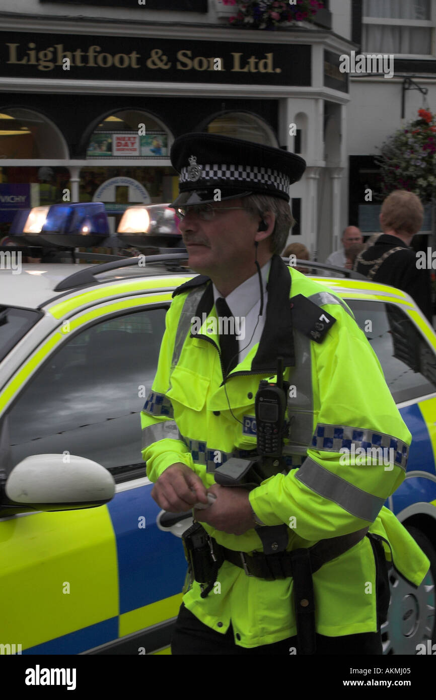 policeman next to vehicle Stock Photo - Alamy