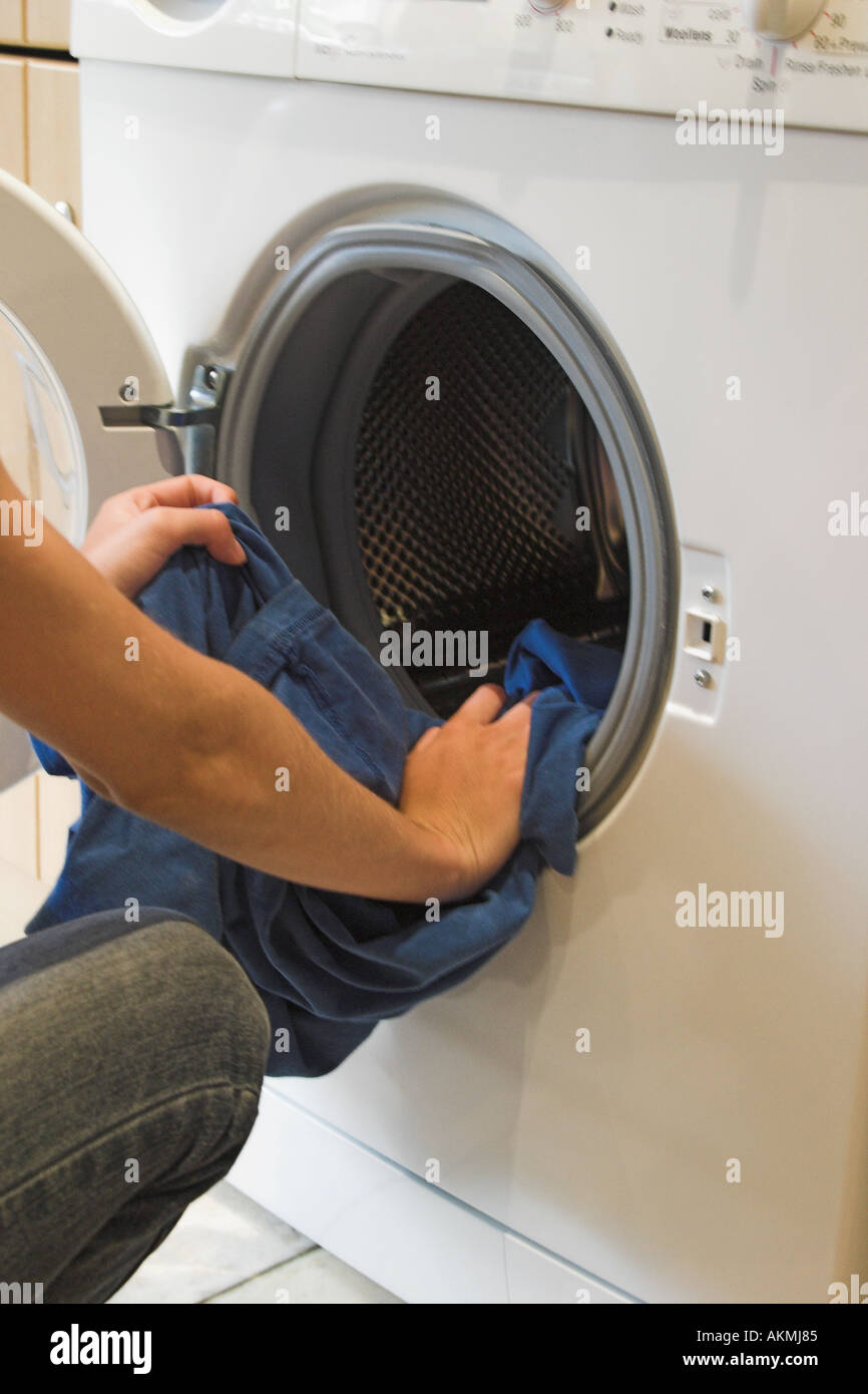Lady washing clothes hi-res stock photography and images - Alamy
