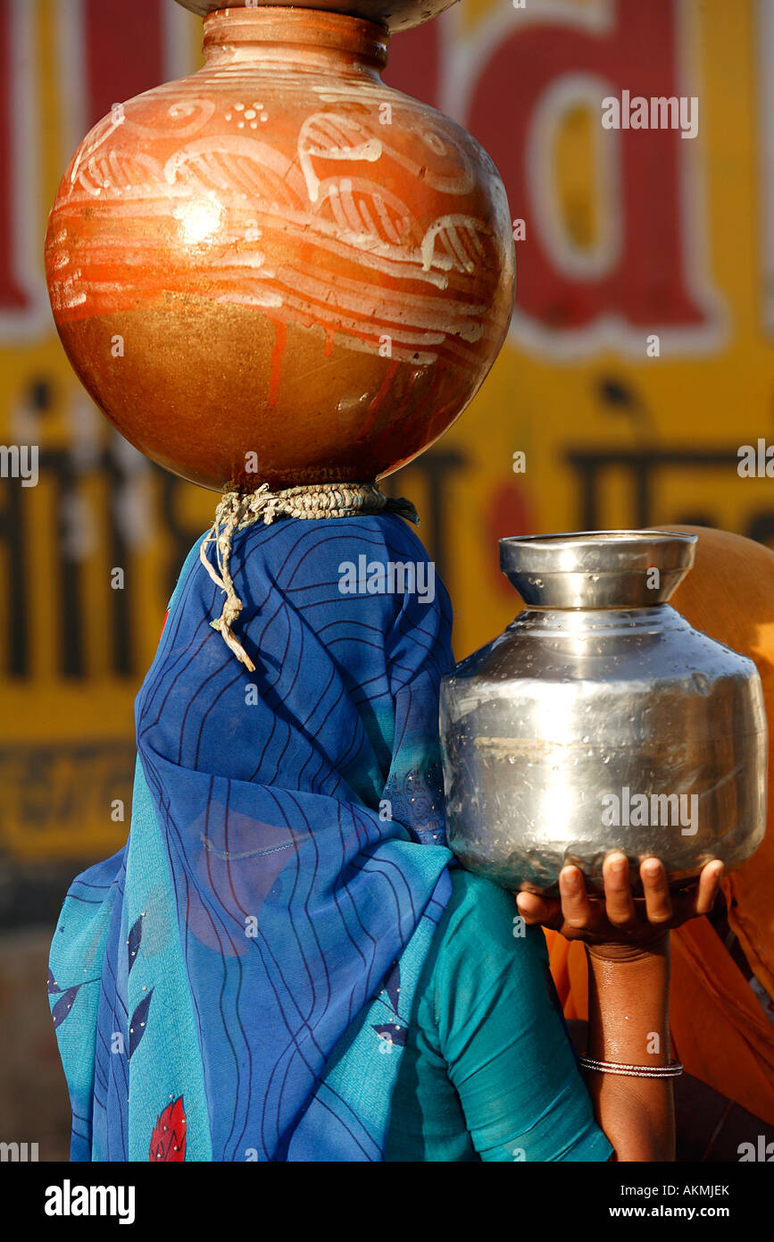 Carrying water jars hi-res stock photography and images - Alamy