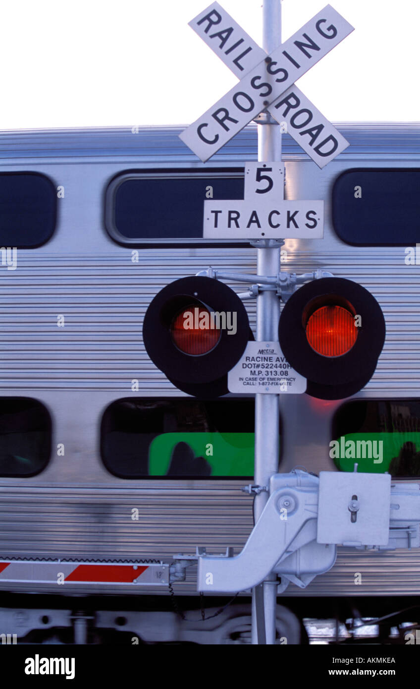 Railroad Crossing Sign and Commuter Train Stock Photo - Alamy