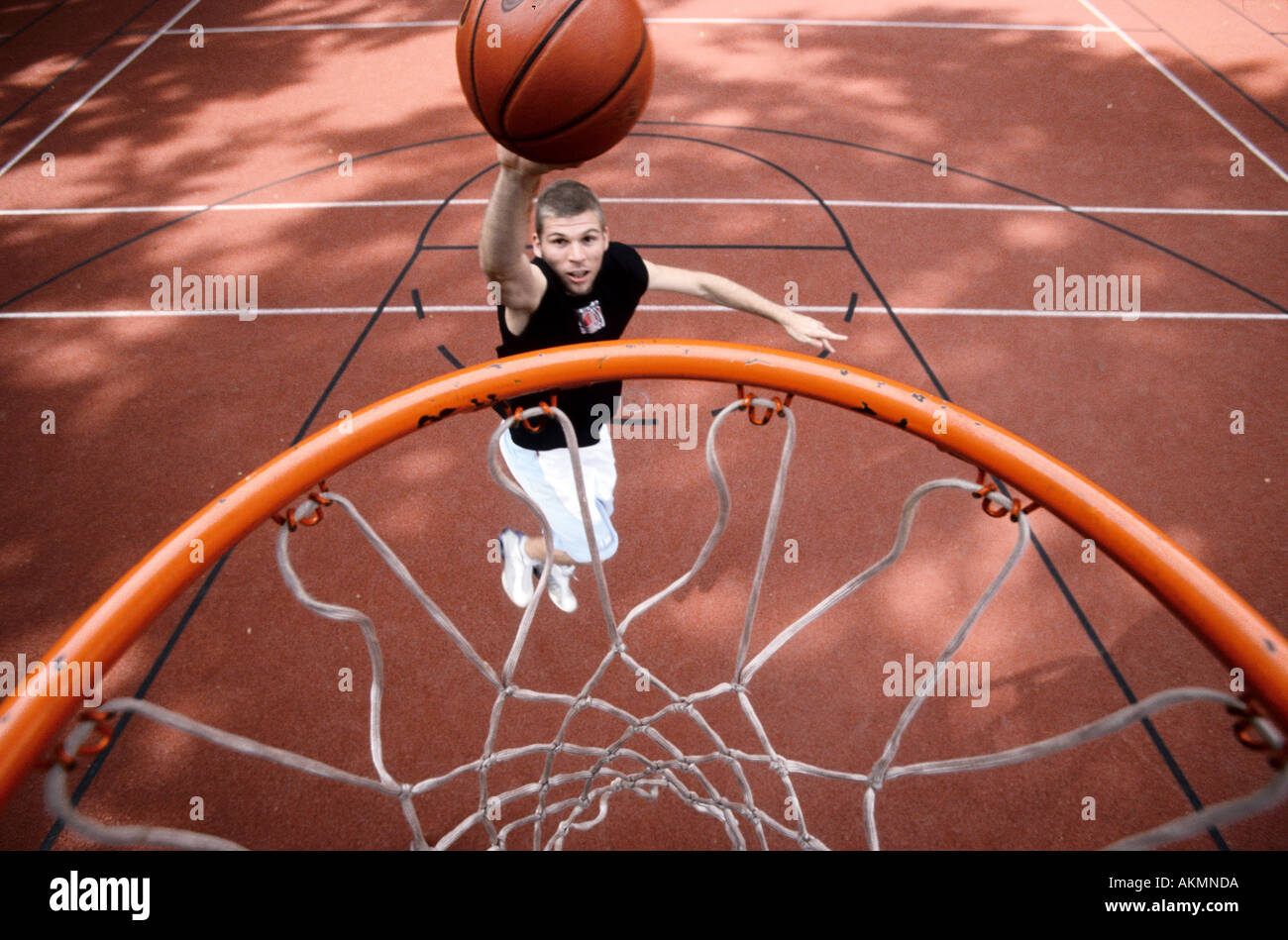 Germany Free time A young man playing basketball Stock Photo - Alamy