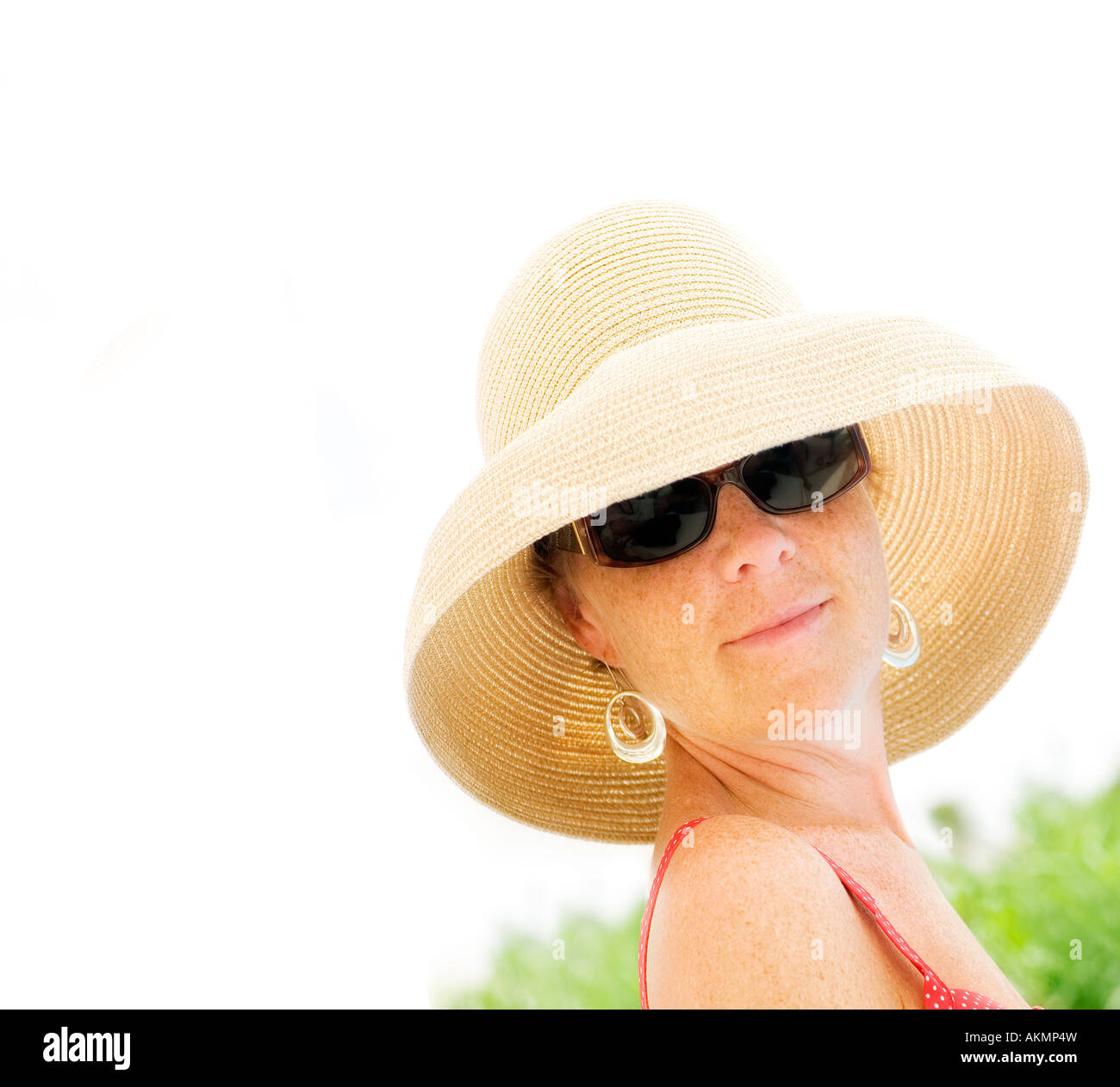 Woman wearing straw hat Stock Photo - Alamy