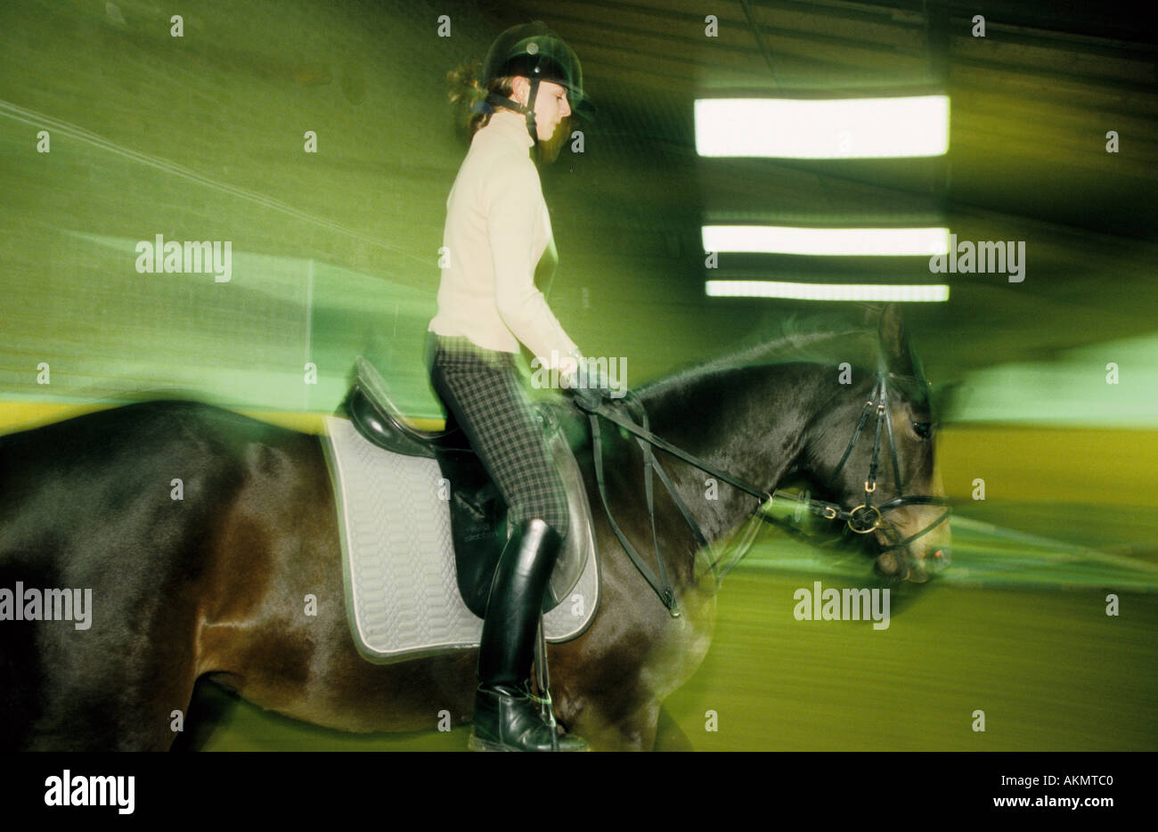Boy with horse in riding hall hi-res stock photography and images - Alamy