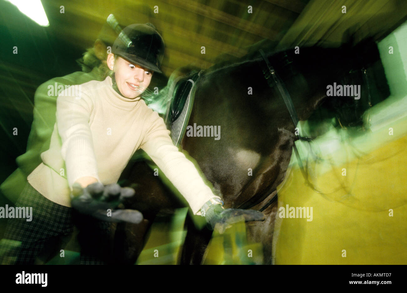 Young woman and her horse riding hall hi-res stock photography and ...