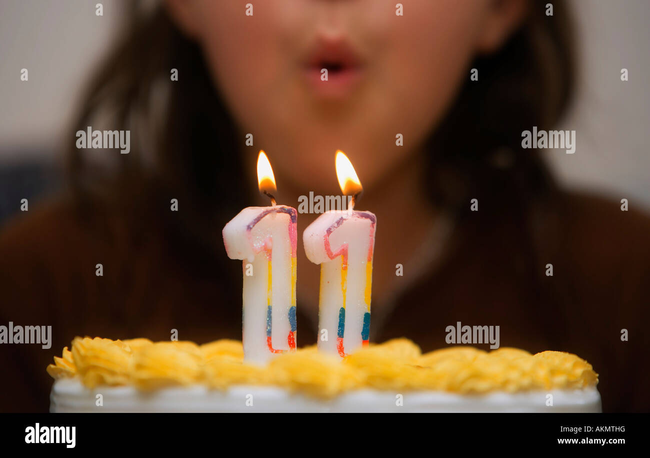 Close up girl blowing out candles hi-res stock photography and images ...
