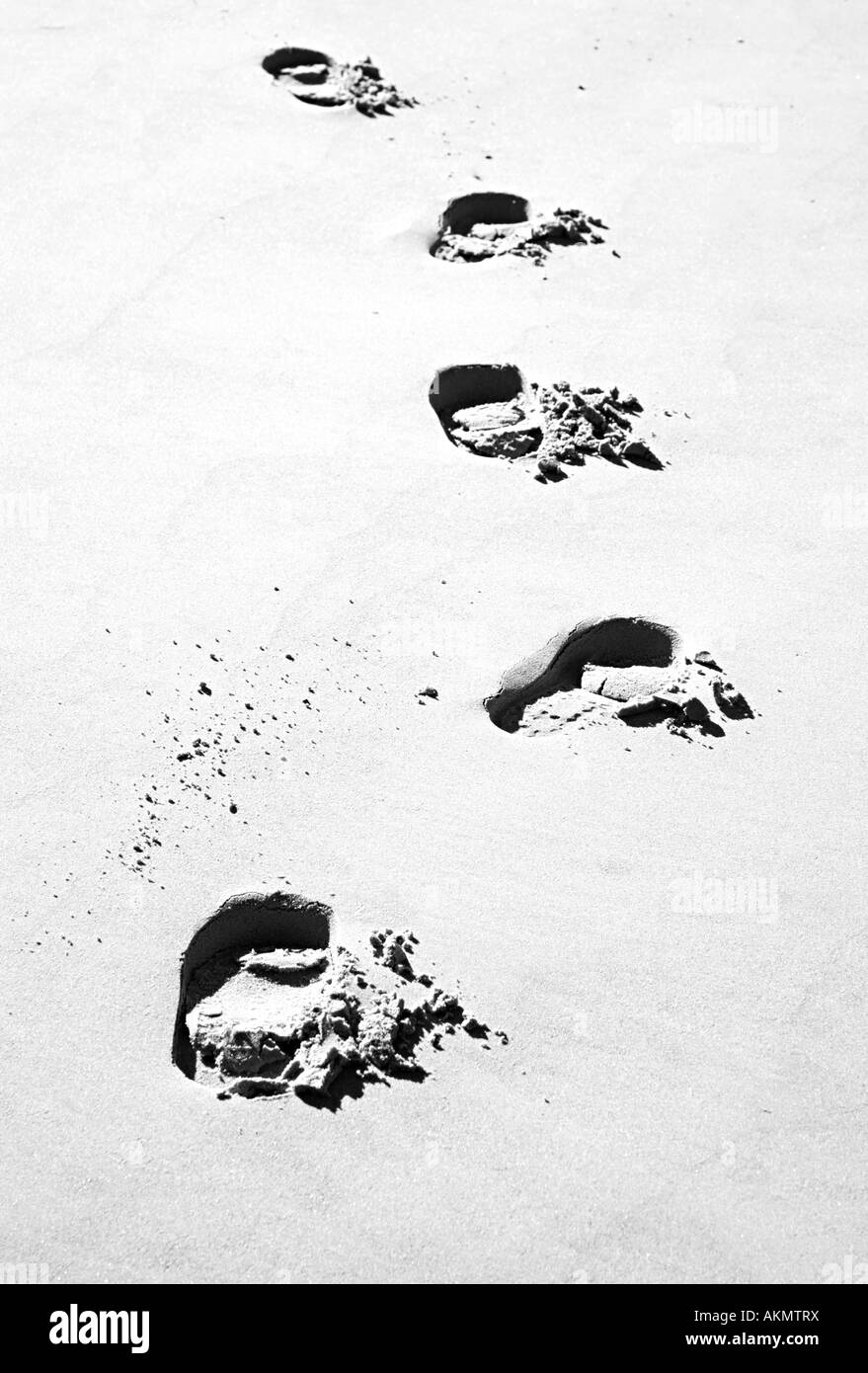 Deep footprints in the sand in high key mono on Wells Beach Norfolk UK ...