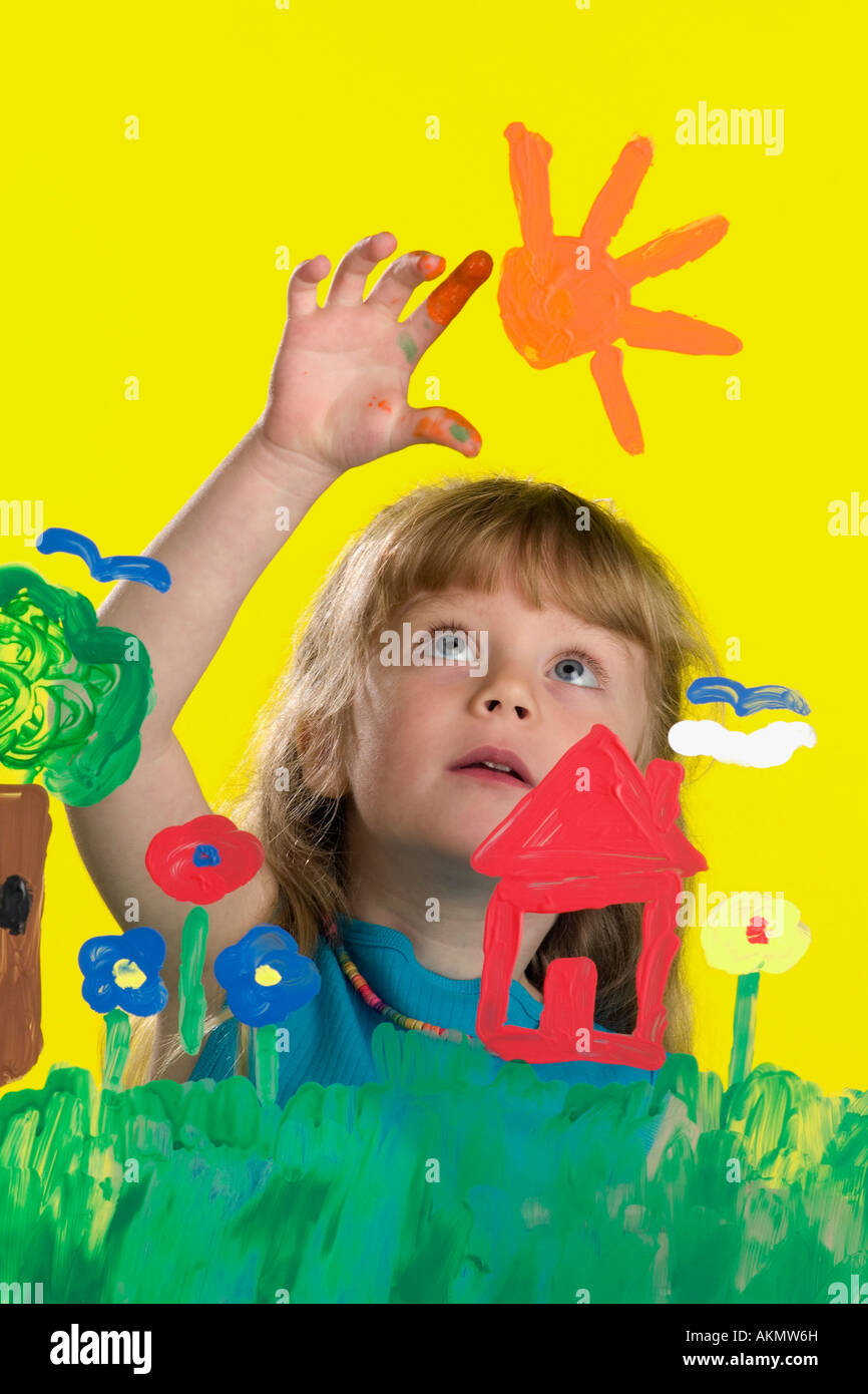 Girl painting on glass Stock Photo - Alamy