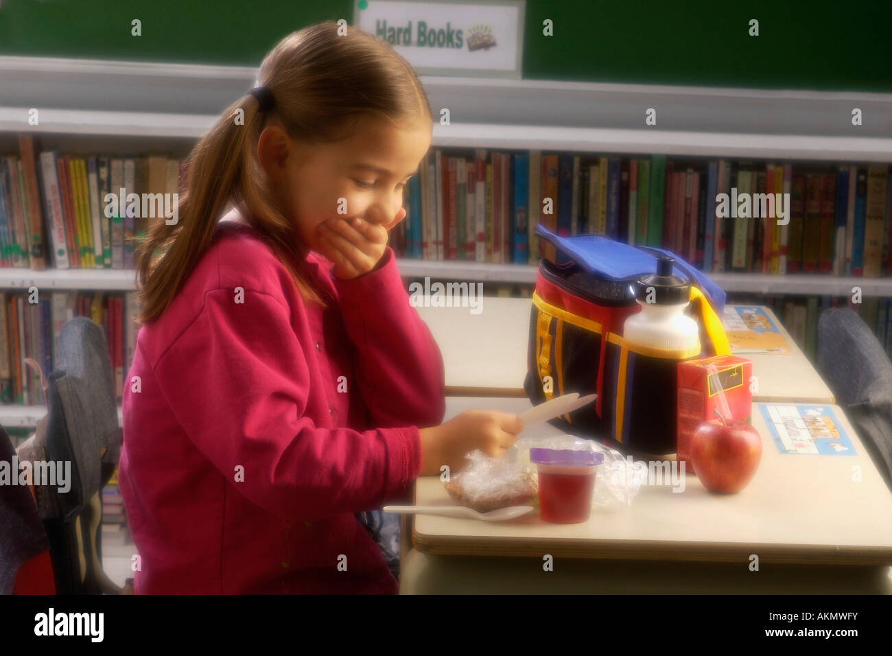 Laughing school girl reading hi-res stock photography and images - Alamy