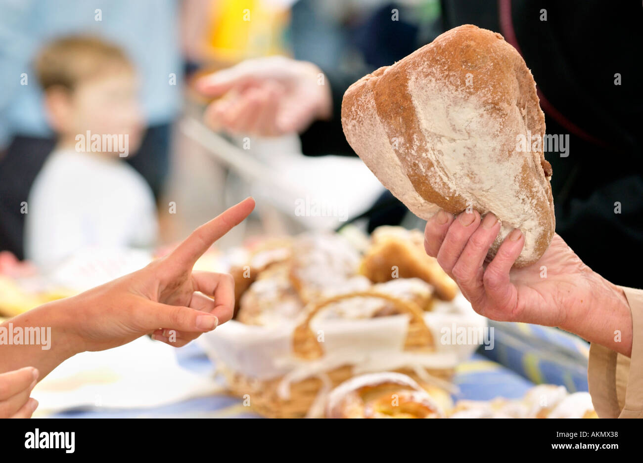 Buying loaf of bread at the annual food festival in Abergavenny ...