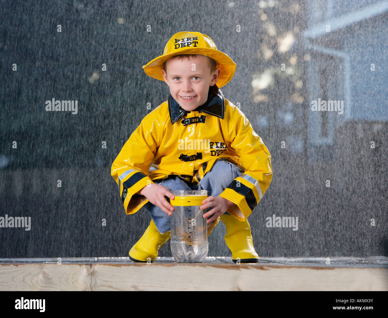 Boy in the rain Stock Photo - Alamy