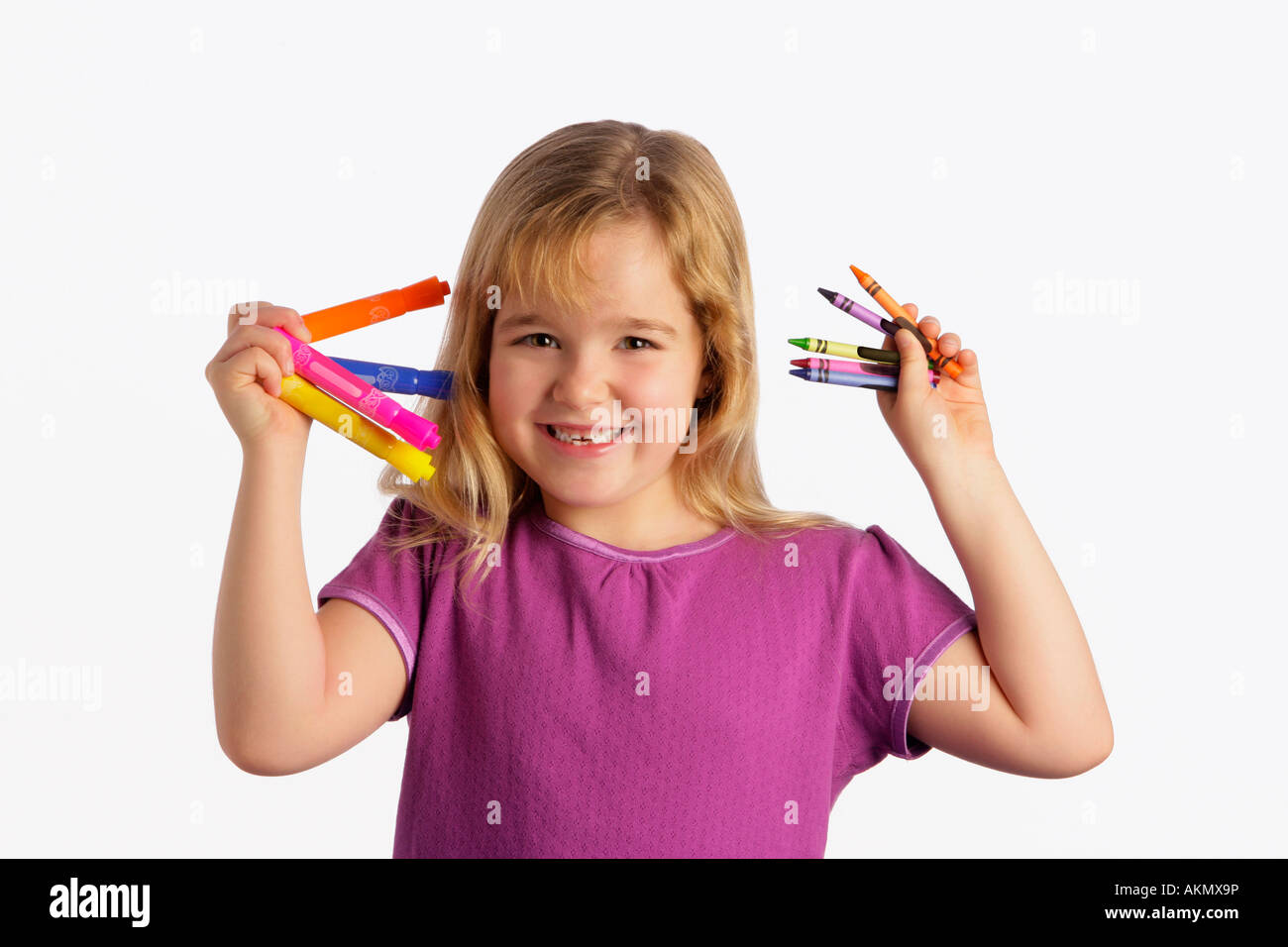 Girl with crayons and markers Stock Photo - Alamy