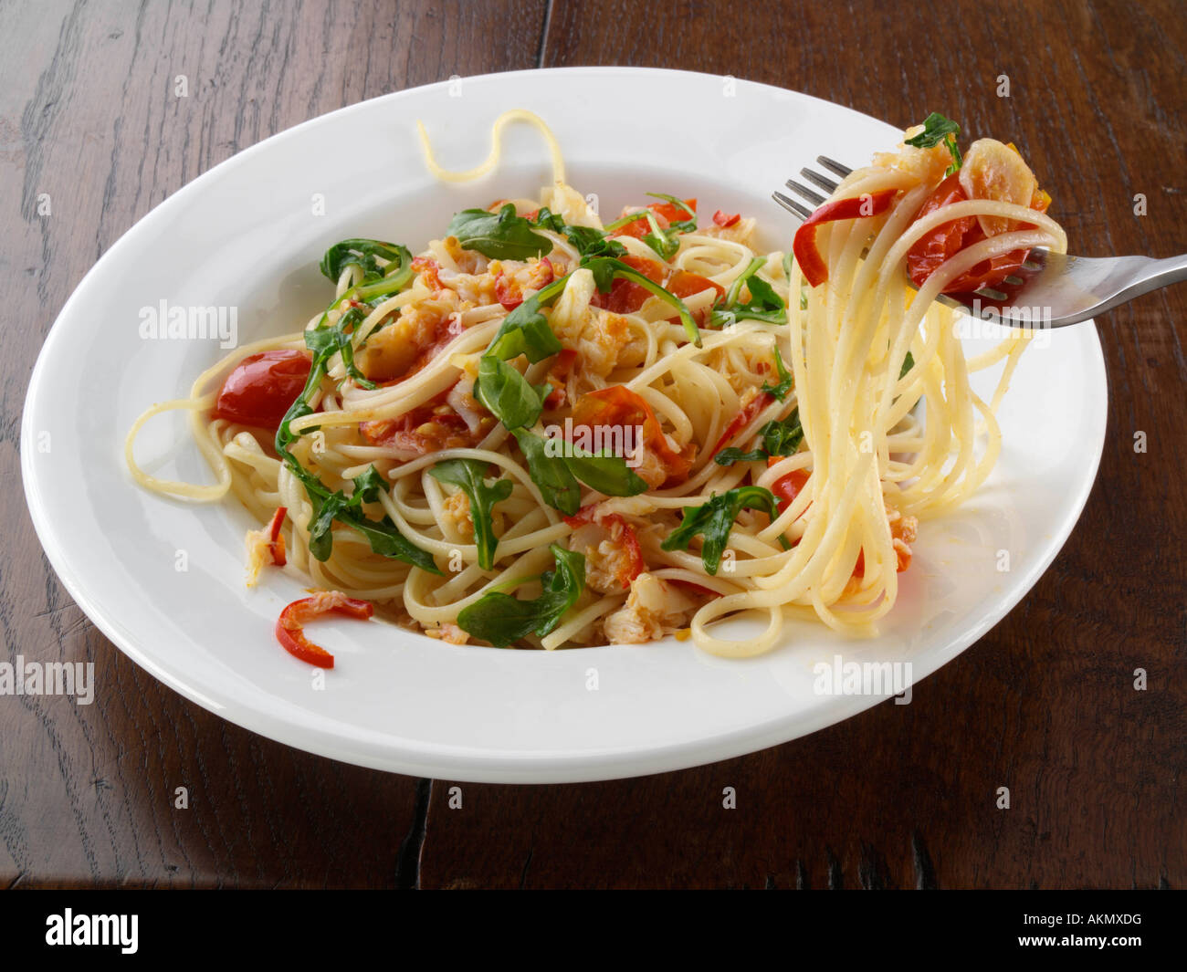 A plate of Italian crab linguini pasta editorial food Stock Photo - Alamy