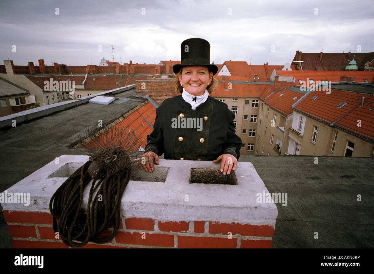 Female chimney sweeper on a roof, Berlin, Germany Stock Photo - Alamy