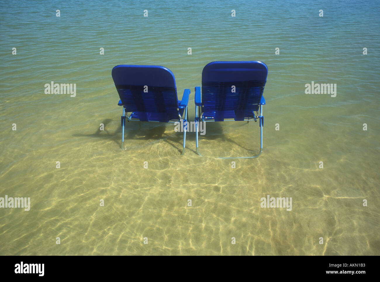 Blue Chairs in Water Stock Photo - Alamy