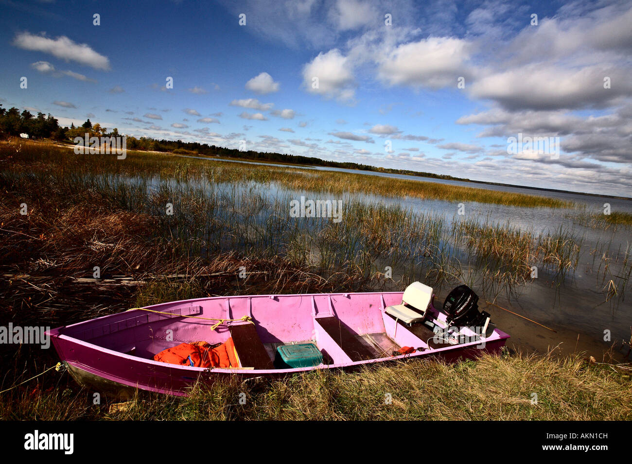 Pink boat in scenic Saskatchewan Stock Photo - Alamy