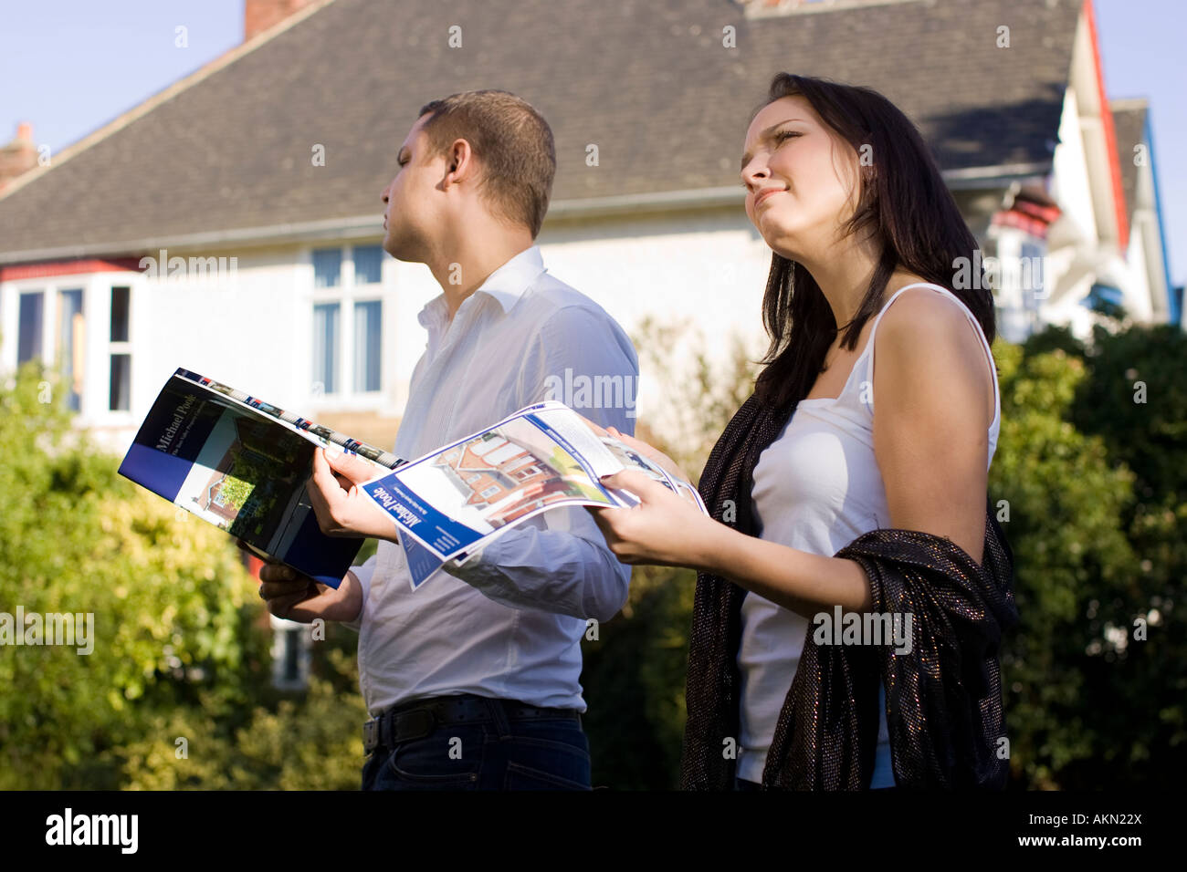 Couple looking at property Stock Photo - Alamy