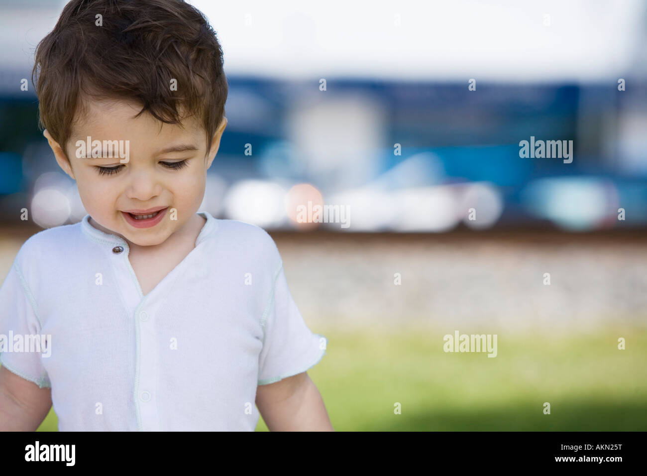 Boy looking down Stock Photo - Alamy