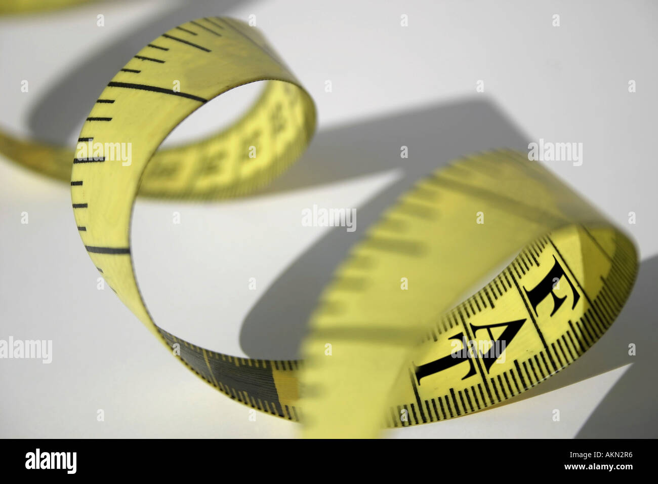 The word FAT on measuring tape Stock Photo - Alamy