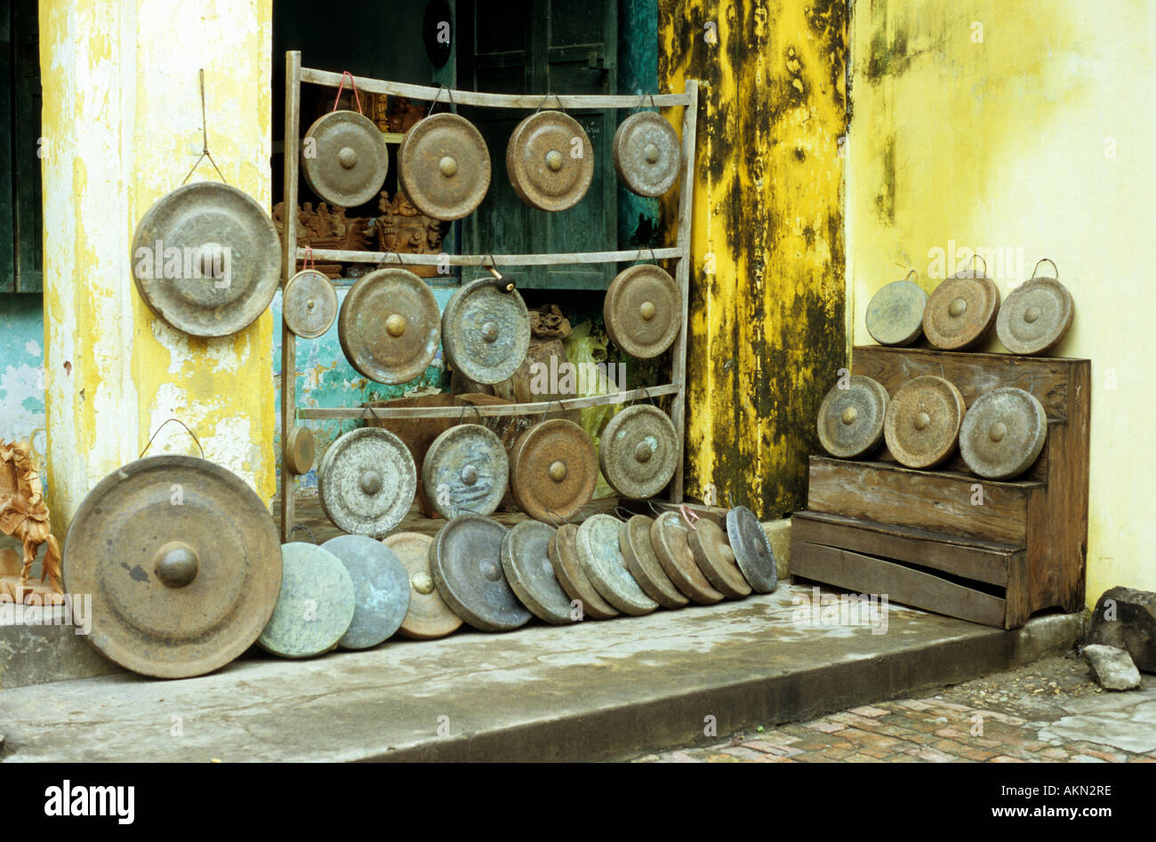 Metal gongs for sale at a shop in Nguyen Thai Hoc Street, Hoi An, Viet ...
