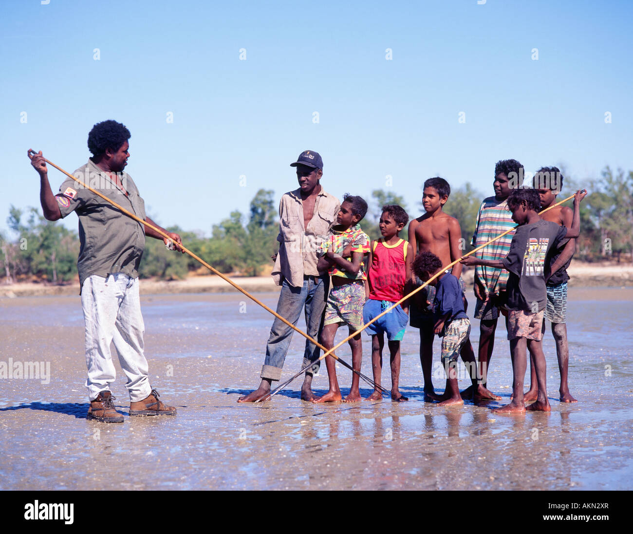 Australian Aboriginal Elder / Ranger teaching the younger generation ...