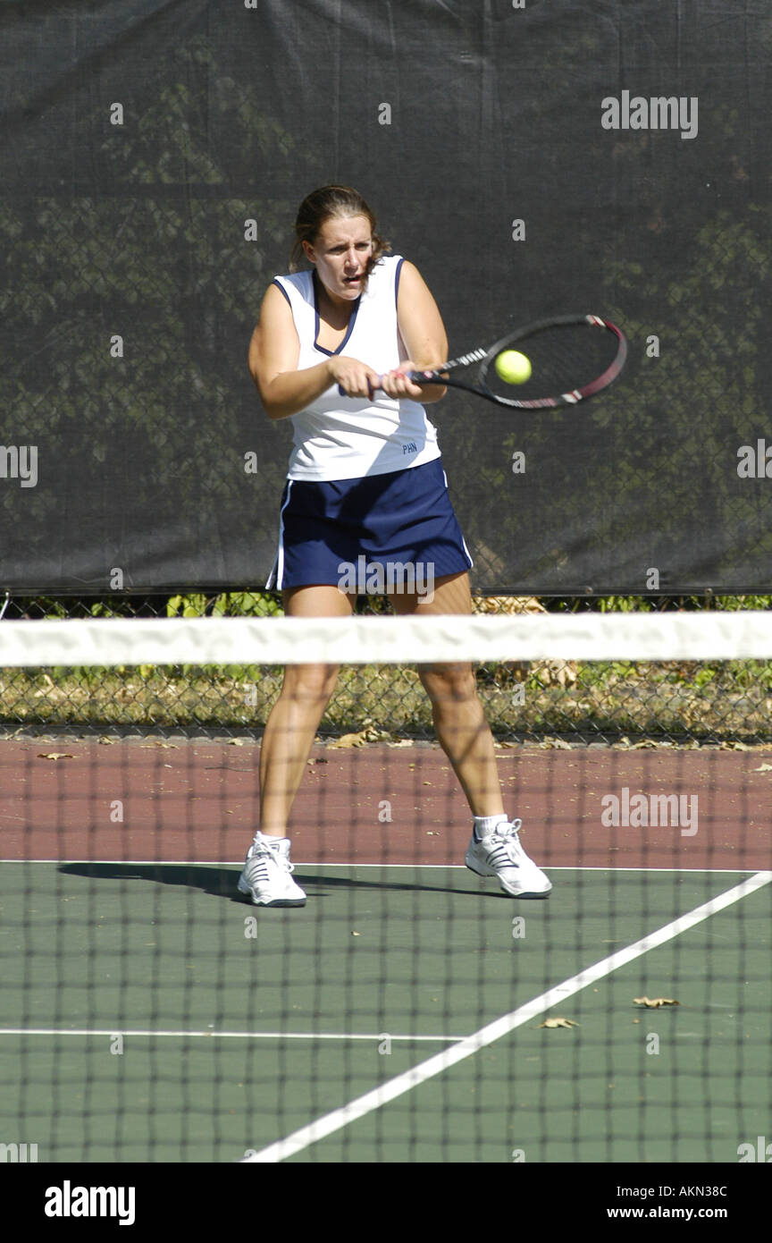 Female doubles match at a high school tennis meet Stock Photo - Alamy