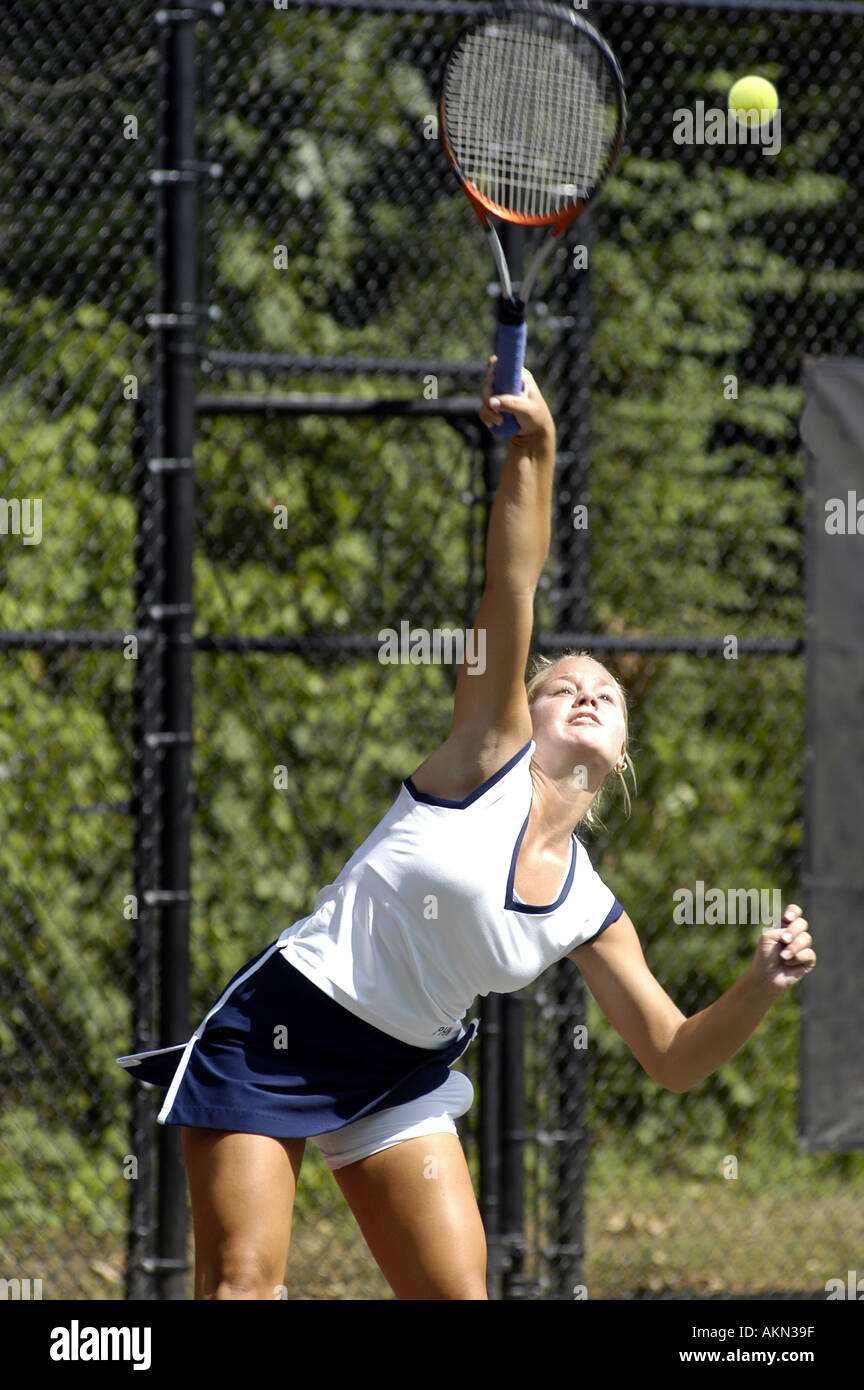 Female doubles match at a high school tennis meet Stock Photo - Alamy
