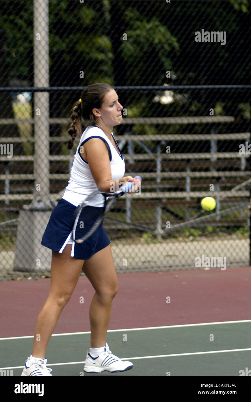 Female doubles match at a high school tennis meet Stock Photo - Alamy