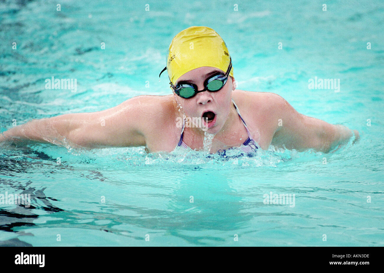 High school swimming meet includes male and female swim contestants ...