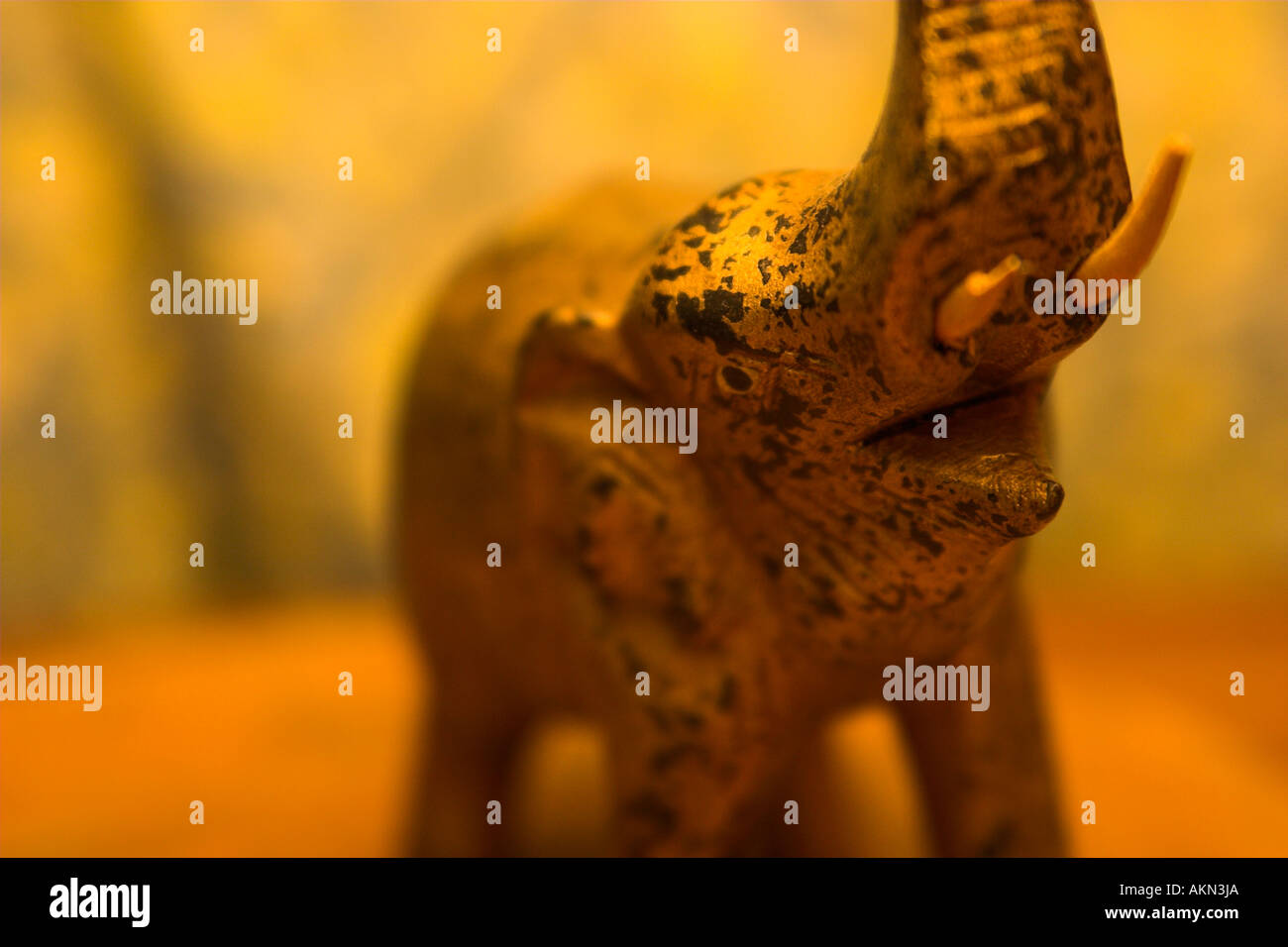 Wooden elephant sculpture in golden color Stock Photo - Alamy