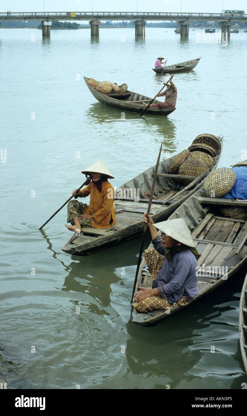 Small ferry boats on the Thu Bon river, at the Bach Dang St fish market ...