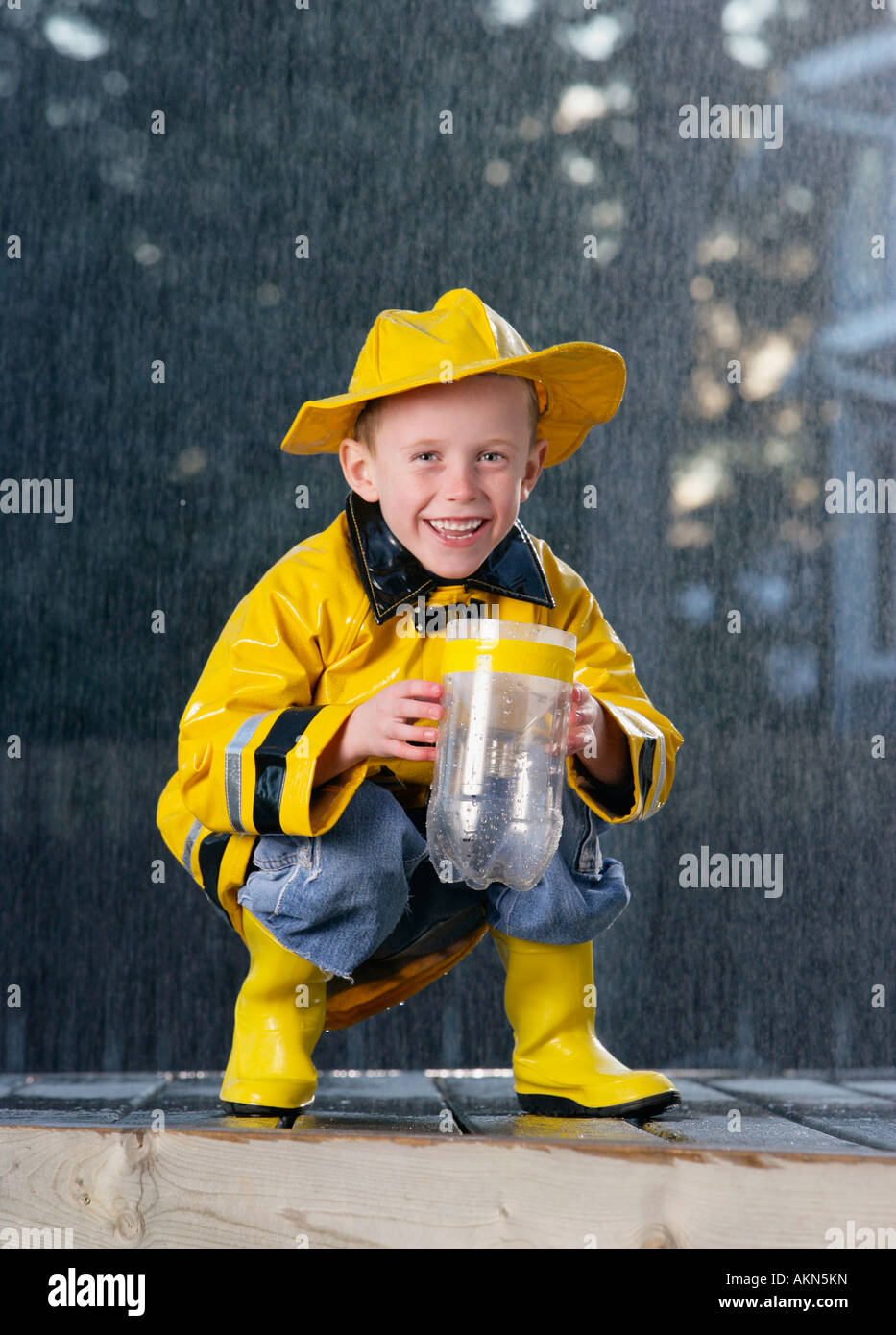 Boy in the rain Stock Photo - Alamy