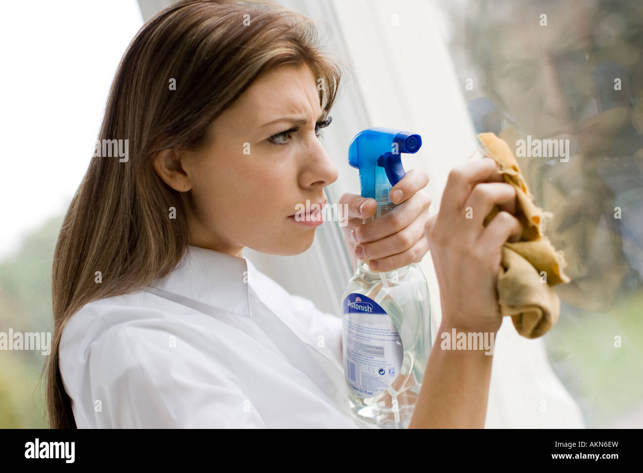 Woman cleaning window Stock Photo - Alamy