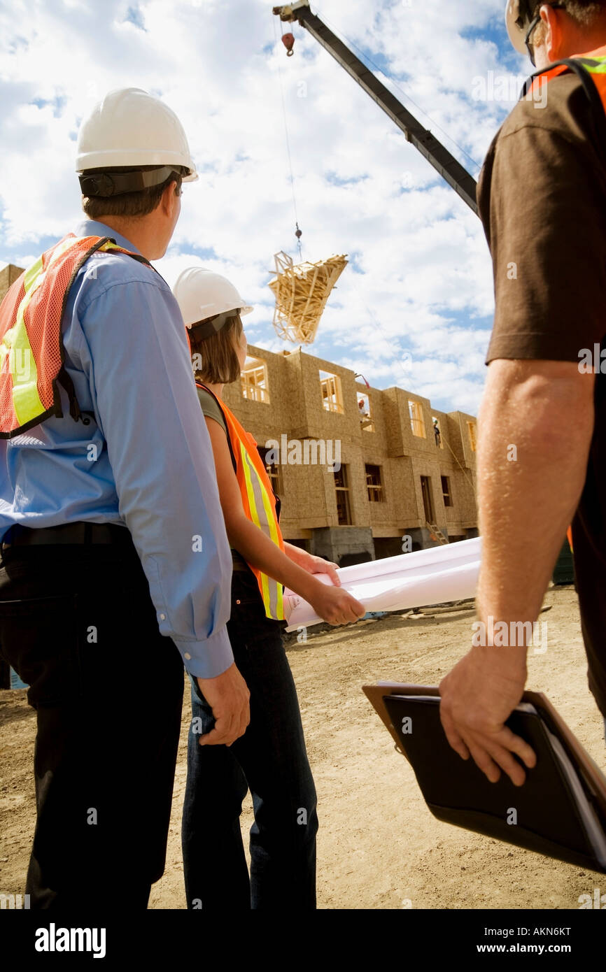 Workers at a construction site Stock Photo - Alamy