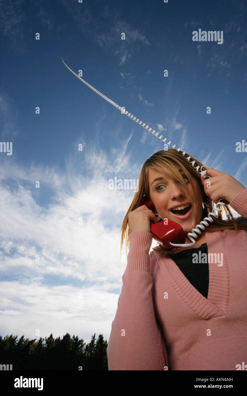 Front view of woman talking on phone Stock Photo - Alamy